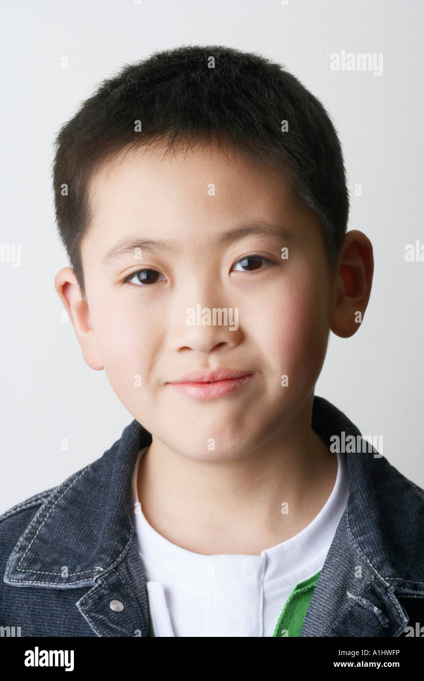 Portrait of a boy grinning Stock Photo - Alamy