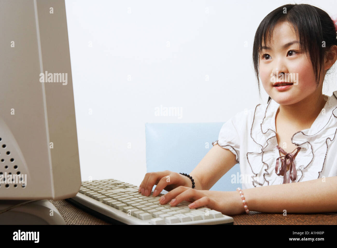Close-up of a young woman using a computer Stock Photo - Alamy