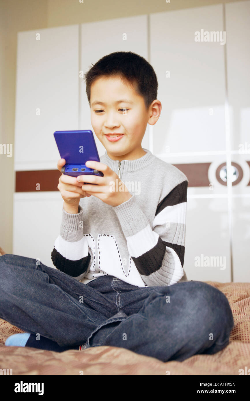 Boy playing a video game Stock Photo - Alamy