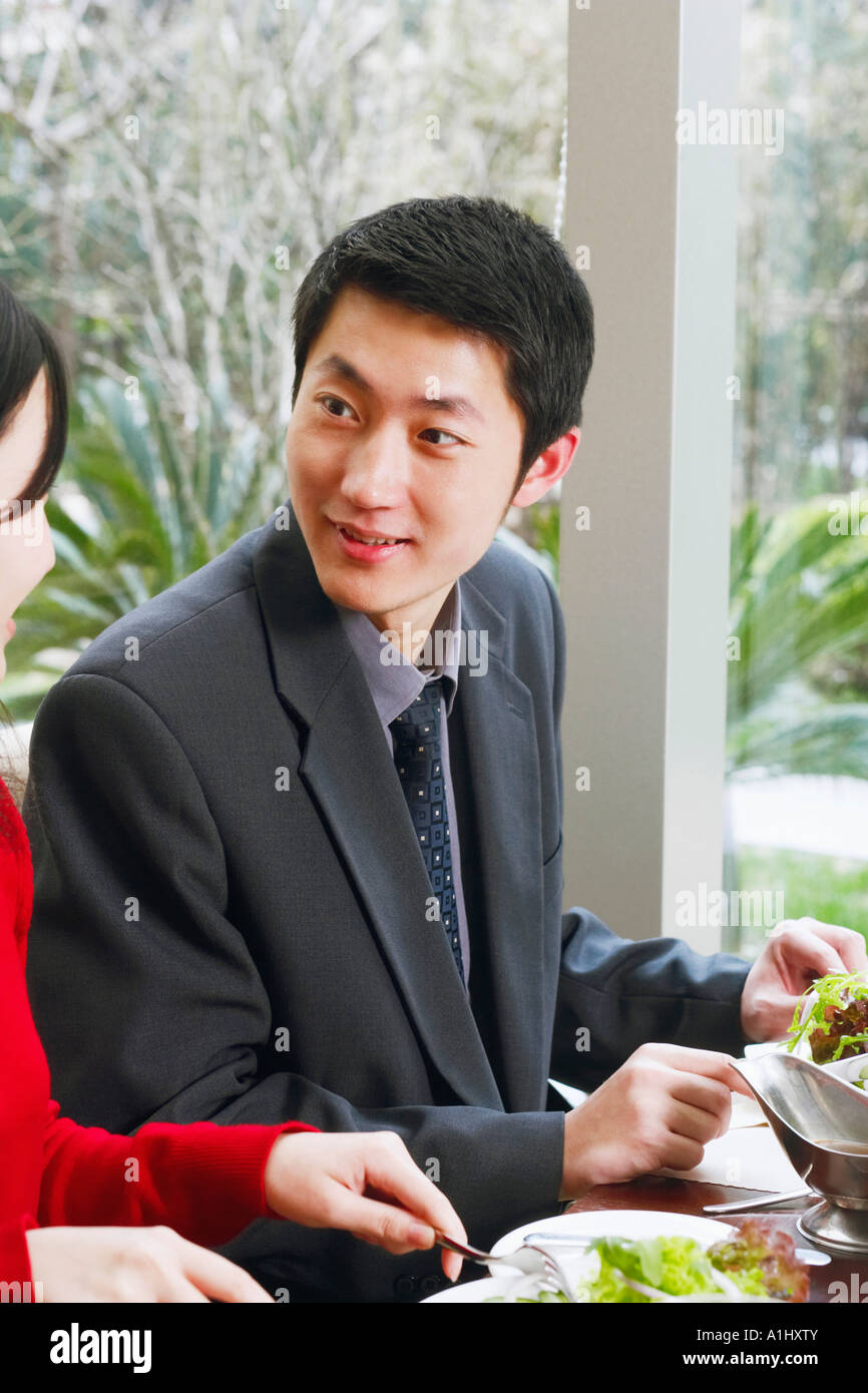 Young man and a young woman seated at the table in a restaurant Stock ...