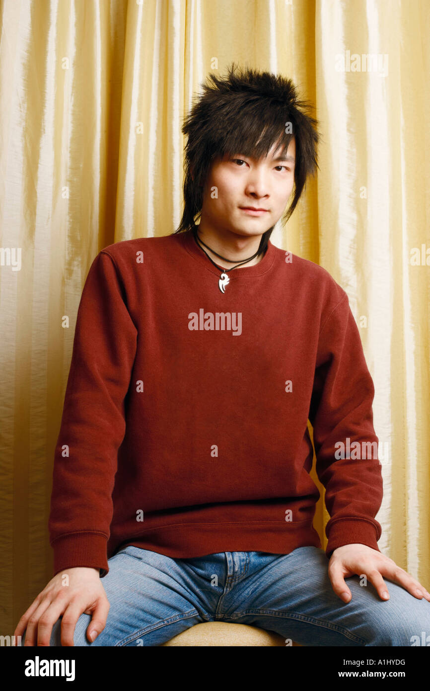 Black man sitting on a stool hi-res stock photography and images - Alamy