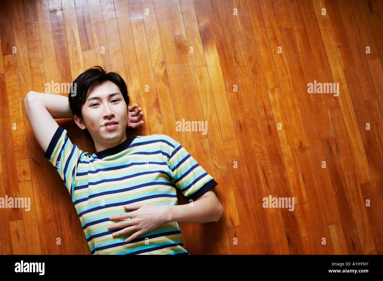 Young black man lying floor hi-res stock photography and images - Alamy