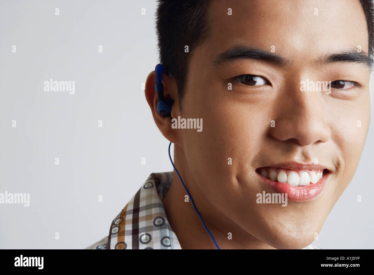 Portrait of a young man wearing headphones Stock Photo - Alamy