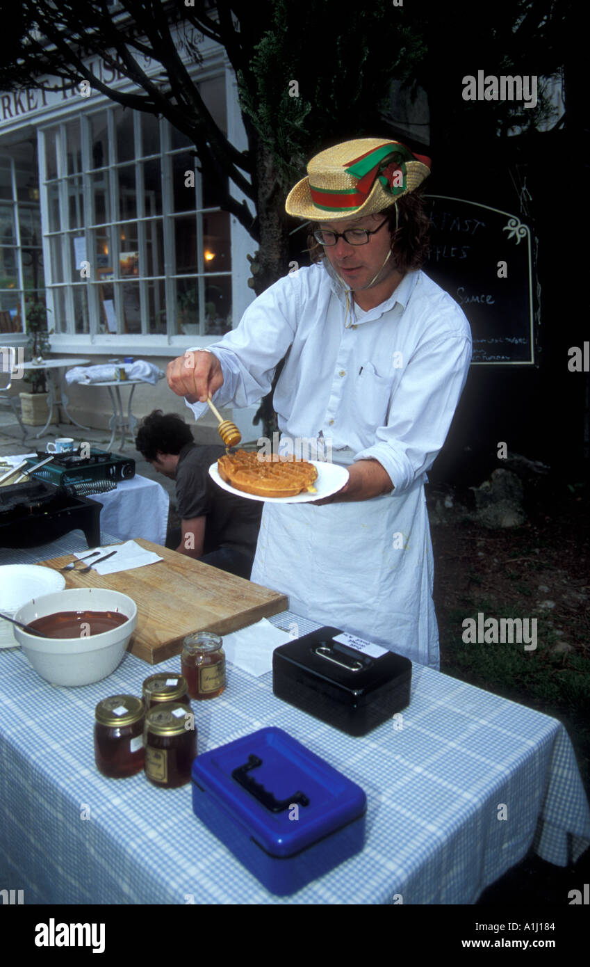 Man cooking waffles at a street festival United Kingdom Stock Photo - Alamy