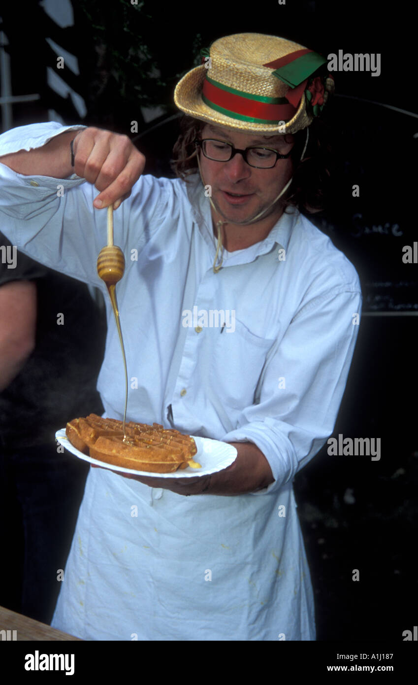 Man cooking waffles at a street festival United Kingdom Stock Photo - Alamy