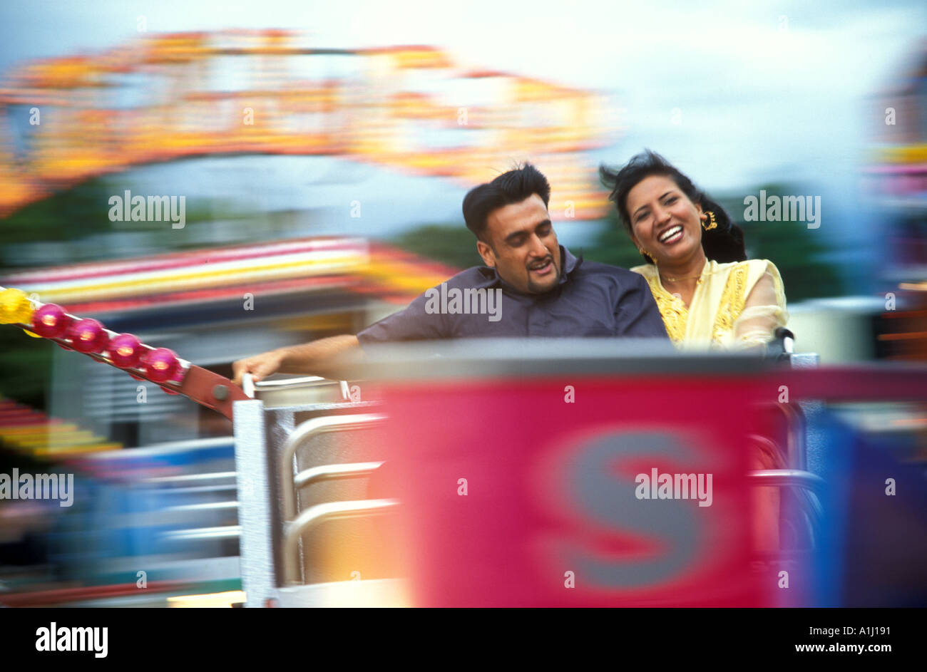 People having fun in an amusement park Stock Photo - Alamy