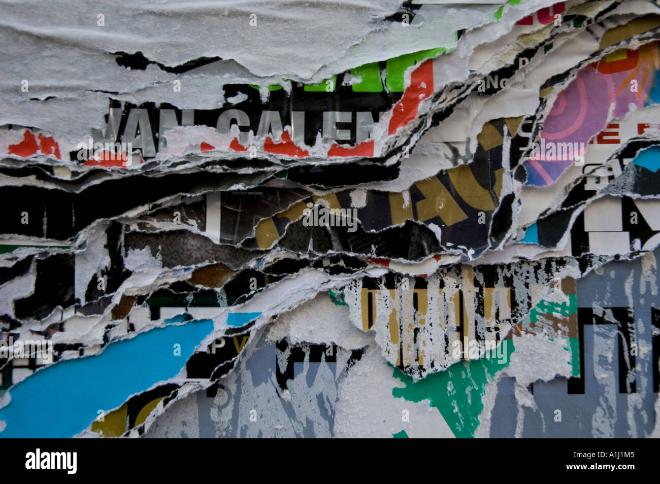 torn posters on wall in amsterdam Stock Photo - Alamy