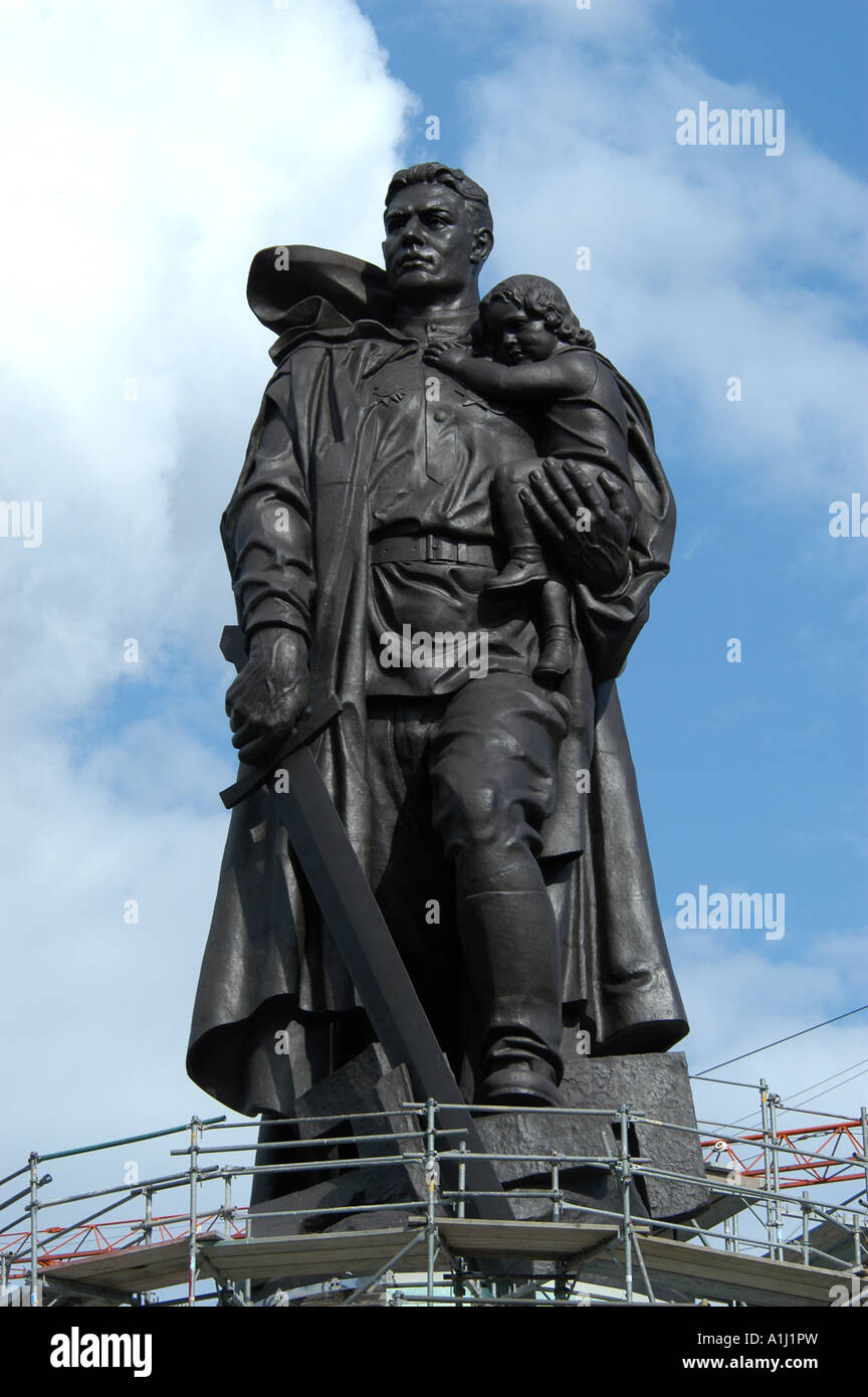 Statue of a Russian soldier holding a German girl at the heart of the ...