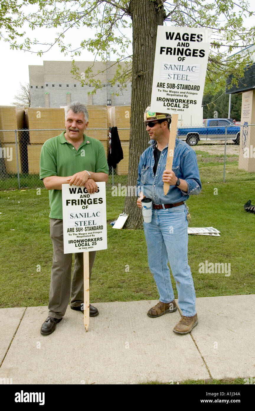 Male union workers on strike on construction project for better wages ...