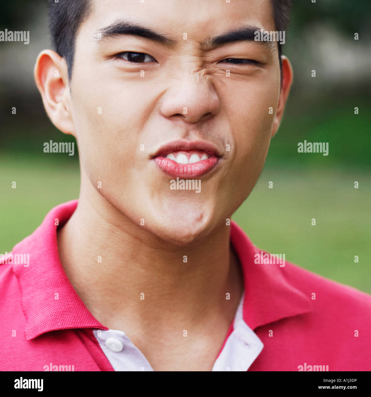 Portrait of a young man making a face Stock Photo - Alamy