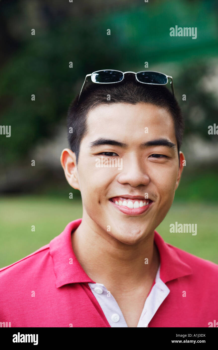 Portrait of a young man smiling Stock Photo - Alamy