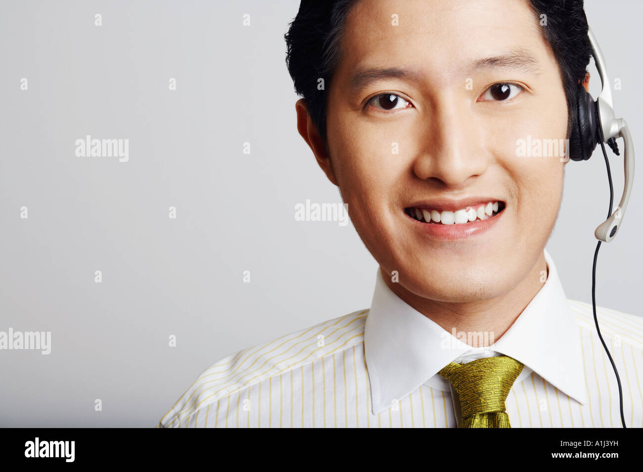 Portrait of a male customer service representative smiling Stock Photo ...