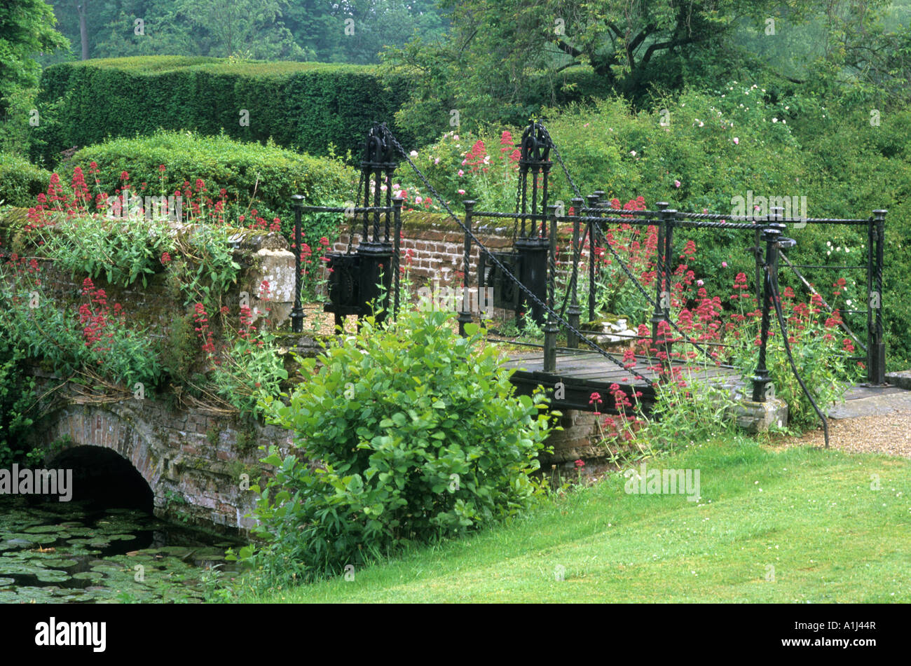 Medieval moat and foot bridge water edge planting Mannington Hall ...