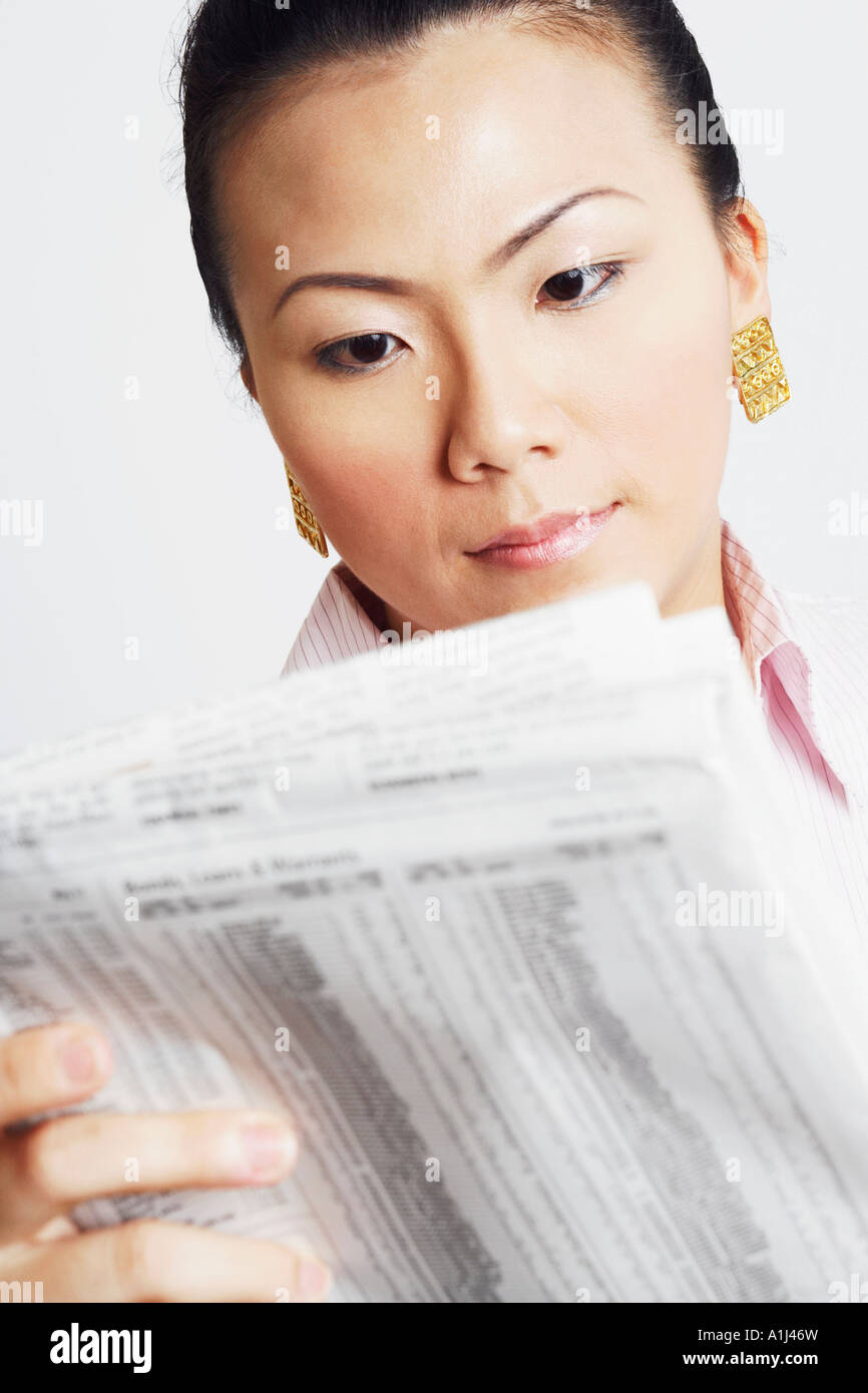 Person holding reading open newspaper hi-res stock photography and ...