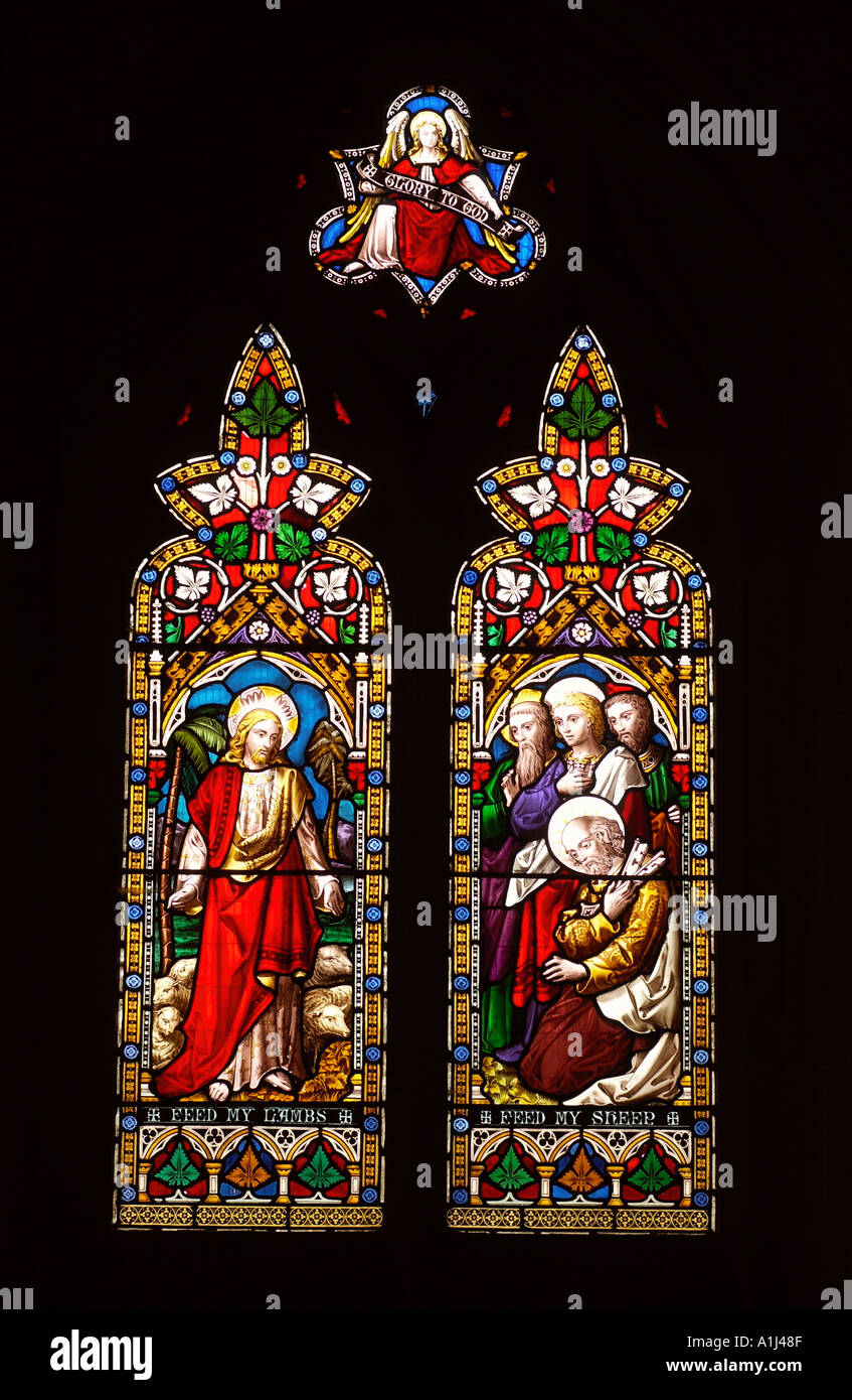 A STAINED GLASS WINDOW SHOWING IMAGES OF SHEEP Stock Photo - Alamy