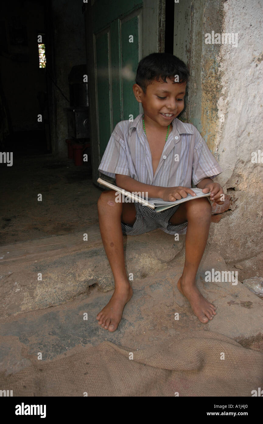 A young boy reading at home in India Stock Photo - Alamy