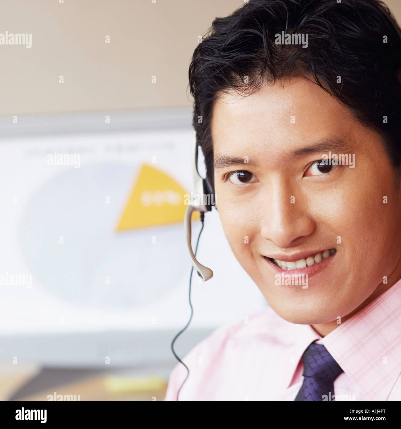 Portrait of a male customer service representative smiling Stock Photo ...