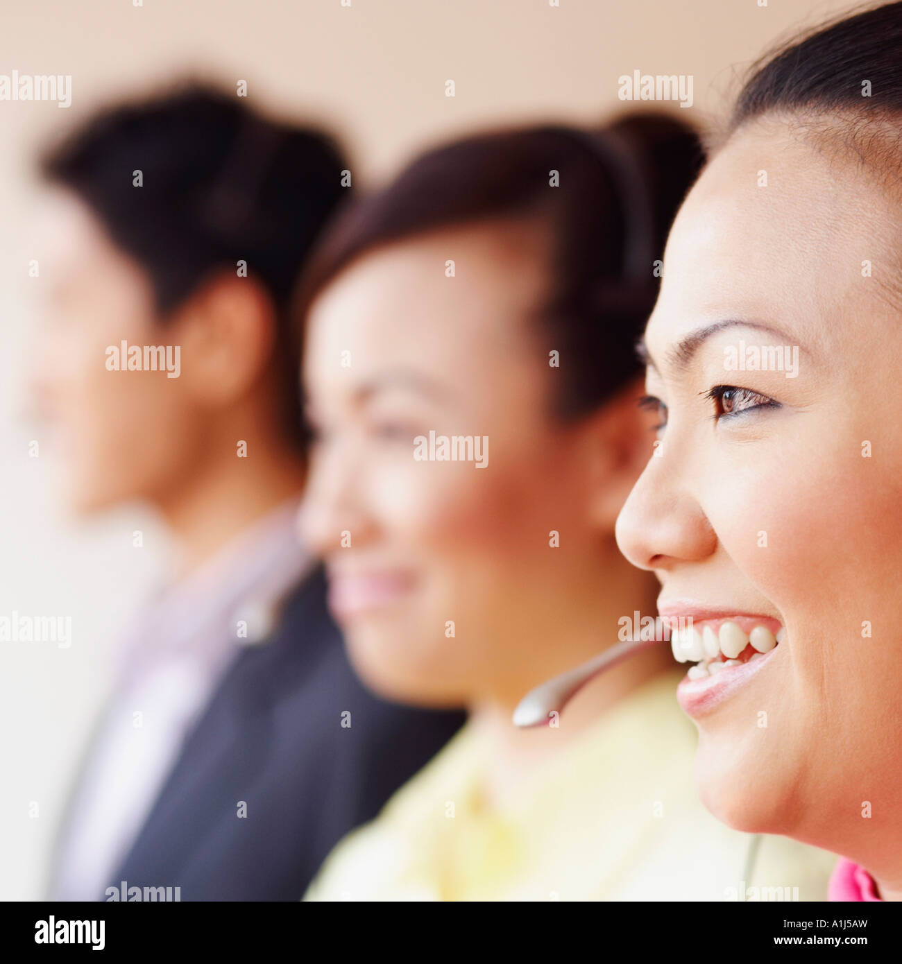 Side profile of a female customer service representative smiling with ...