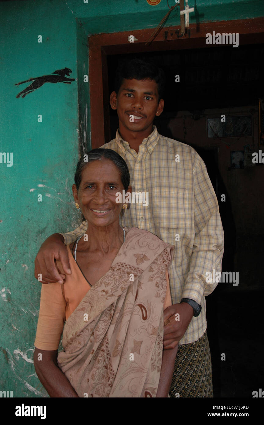A partially sighted woman with her son outside their home in Tamil Nadu ...