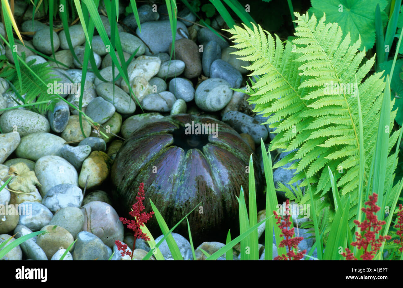 Water feature ceramic pebbles Stock Photo - Alamy
