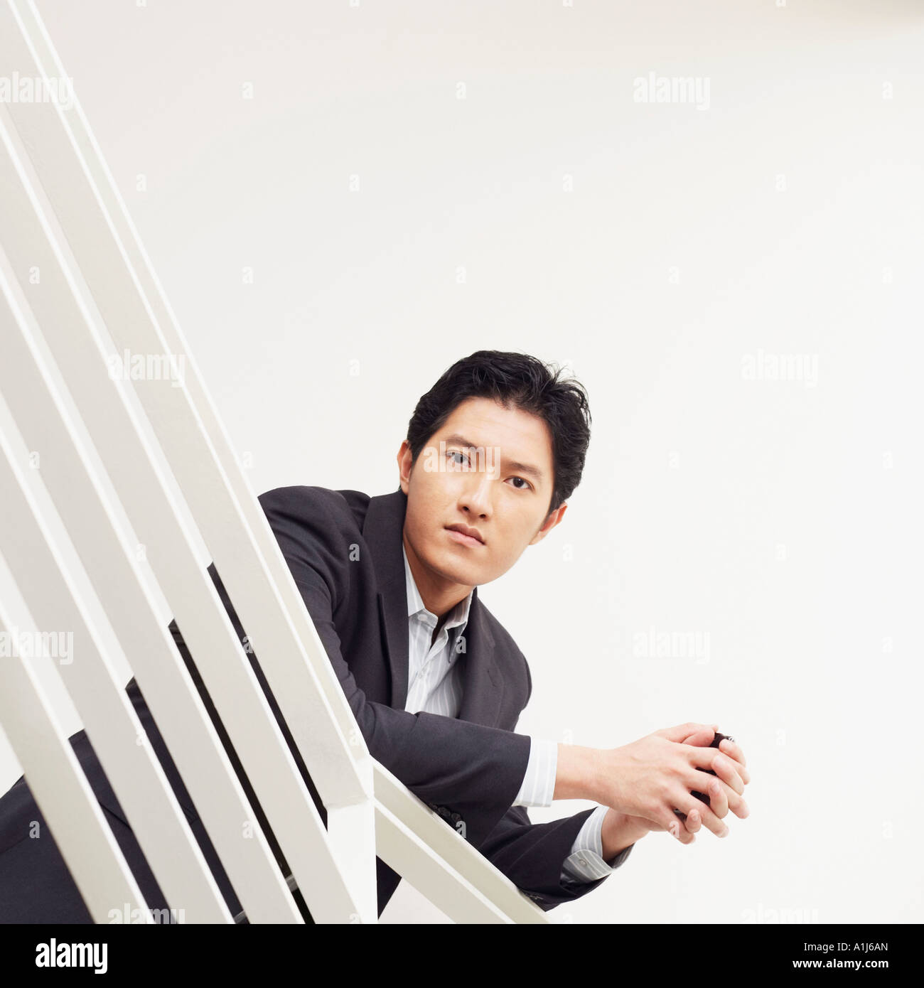 Portrait of a businessman looking serious Stock Photo - Alamy