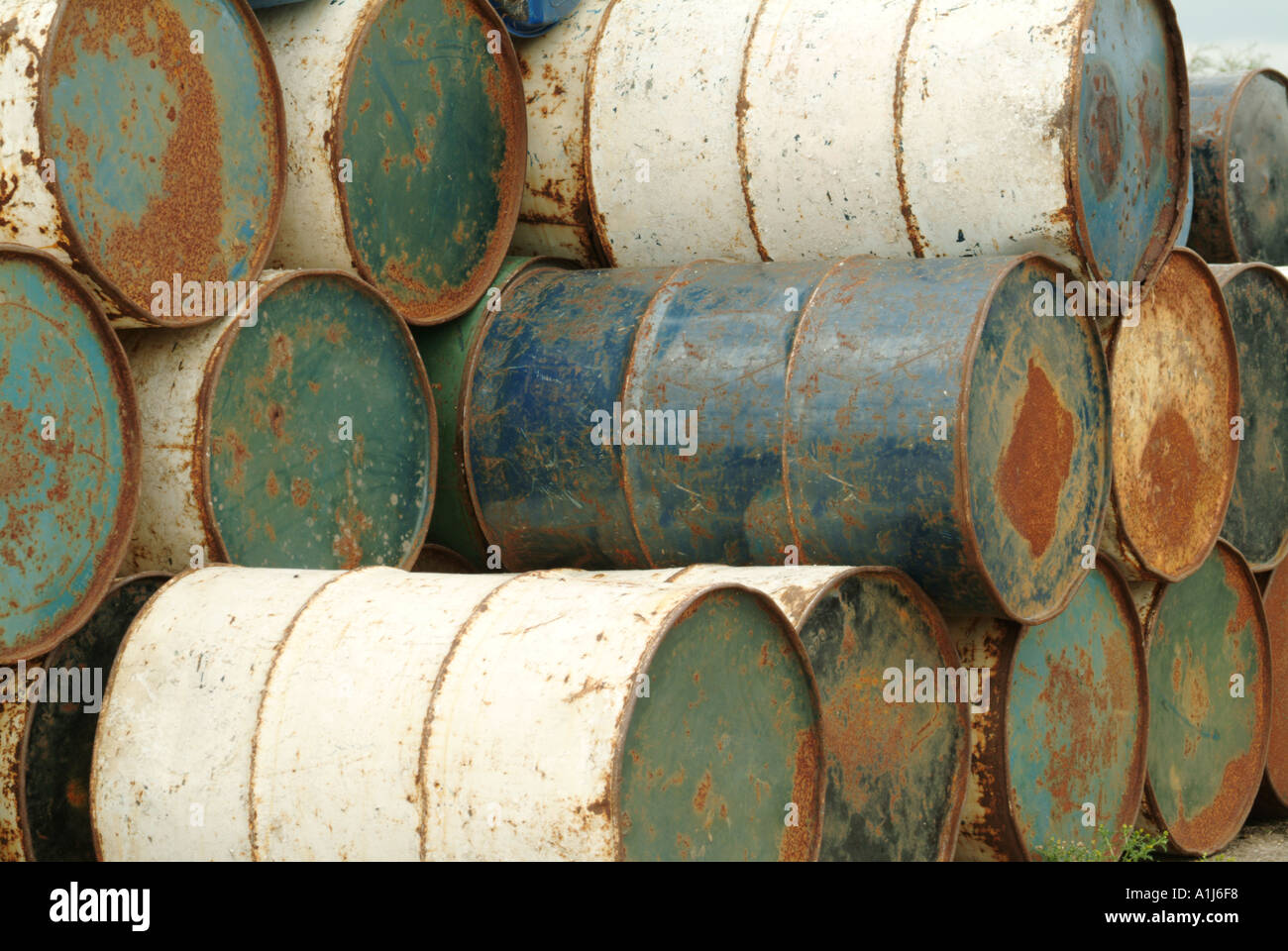 oil barrels stacked up metal consume consumption fuel petrol carbon ...
