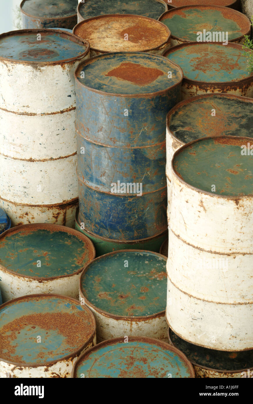 oil barrels stacked up metal consume consumption fuel petrol carbon ...