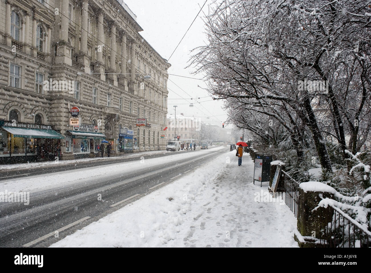 City road in a snow storm, Rainerstrasse, Salzburg, Austria Stock Photo ...