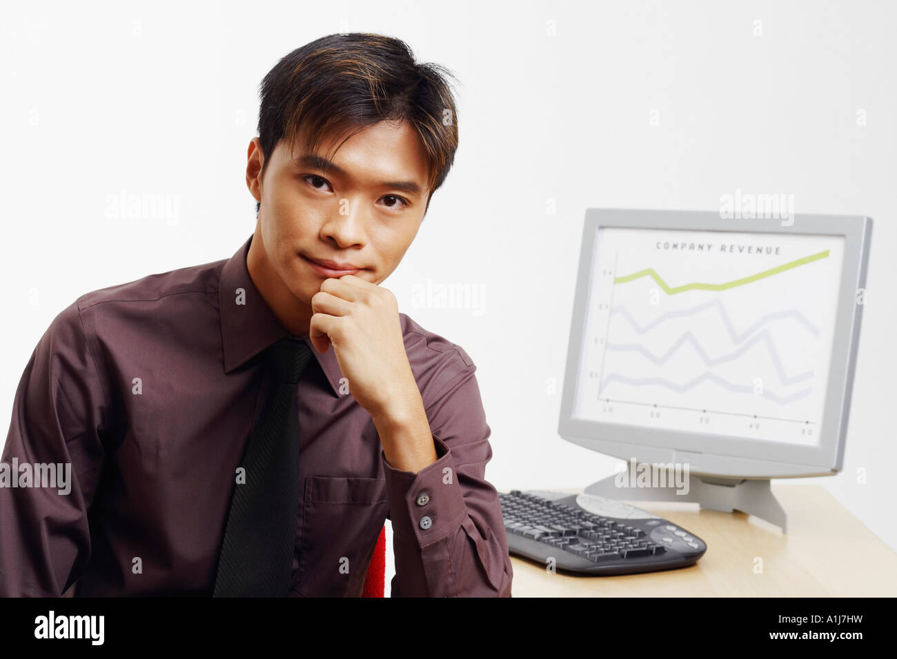 Portrait of a businessman thinking Stock Photo - Alamy