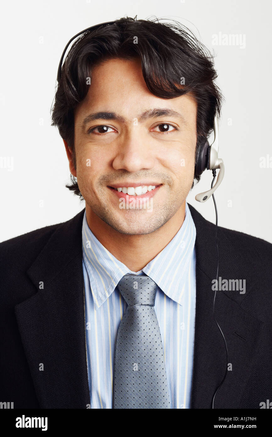 Portrait of a male customer service representative smiling Stock Photo ...