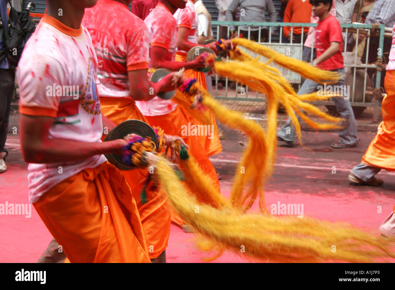 Devotees dancing and playing the musical instrument cymbols Jhanj ...