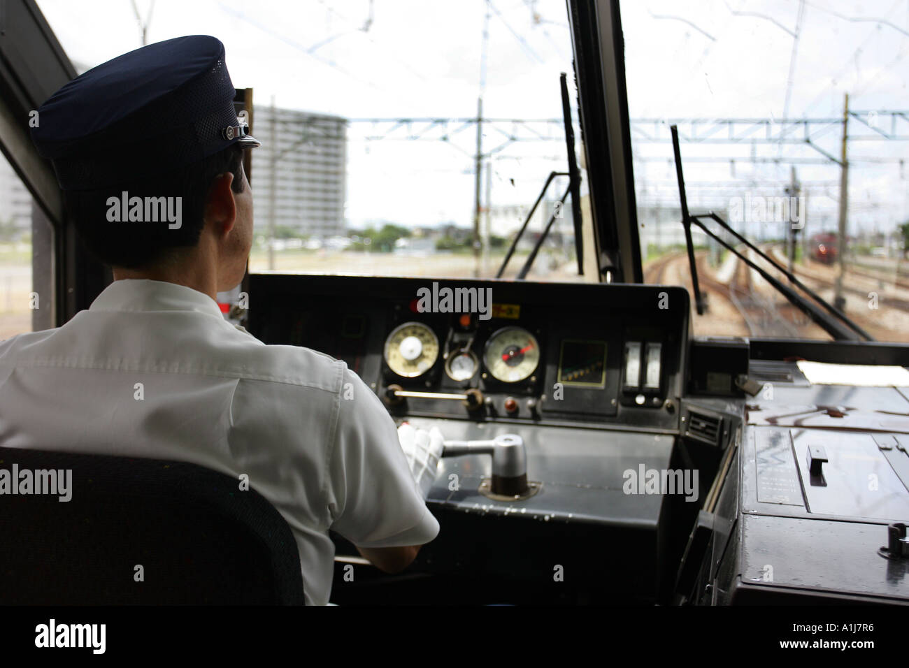 The inside of a train cab with a driver of a Kamome Express train Stock ...