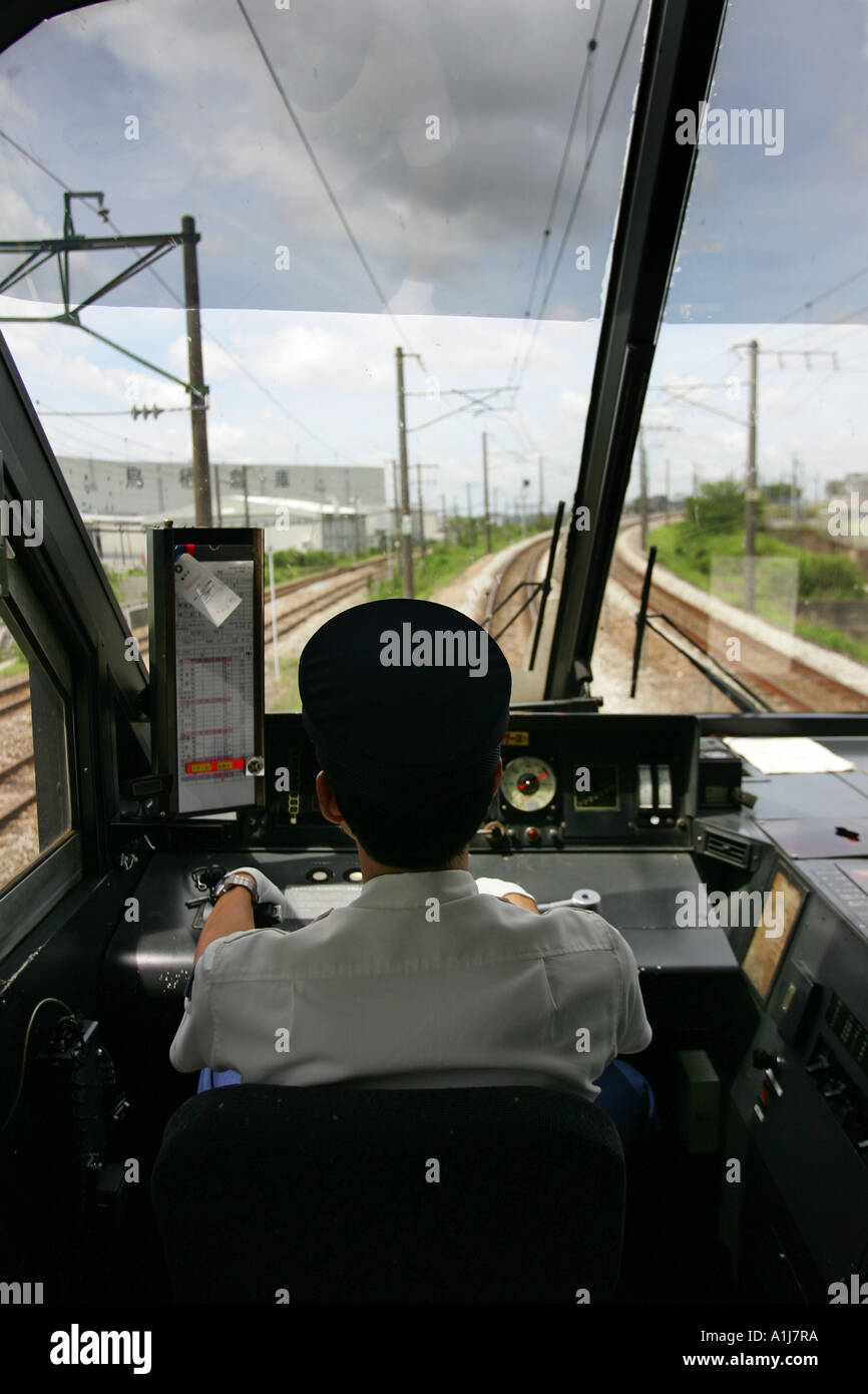 The inside of a train cab with a driver of a Kamome Express train Stock ...