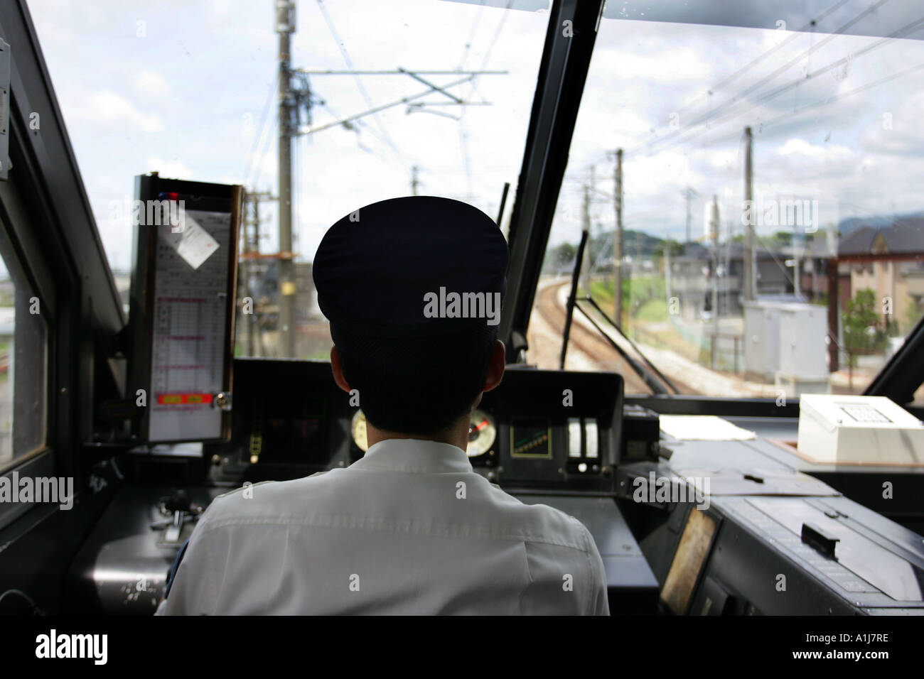 The inside of a train cab with a driver of a Kamome Express train Stock ...
