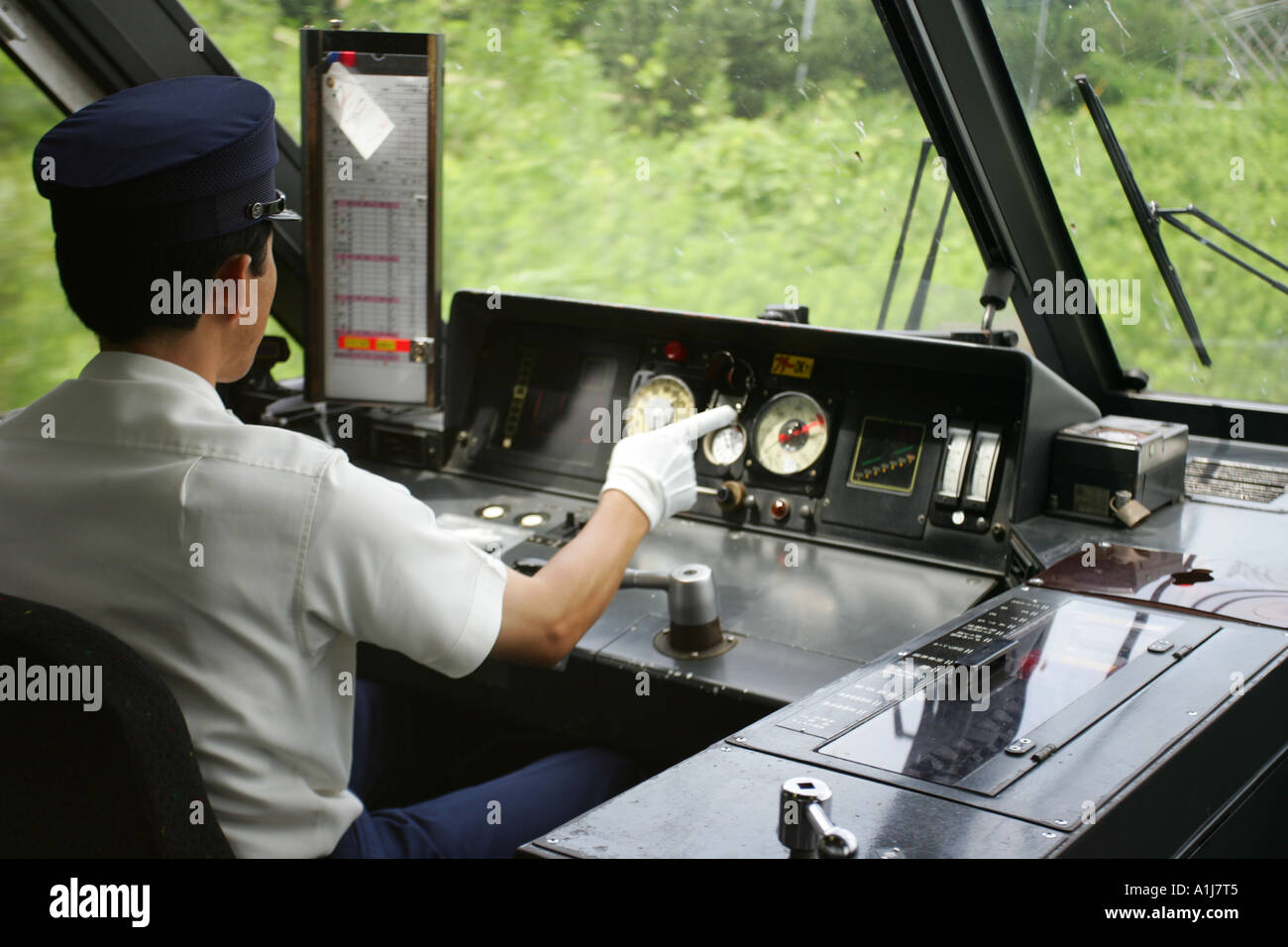The inside of a train cab with a driver of a Kamome Express train Stock ...