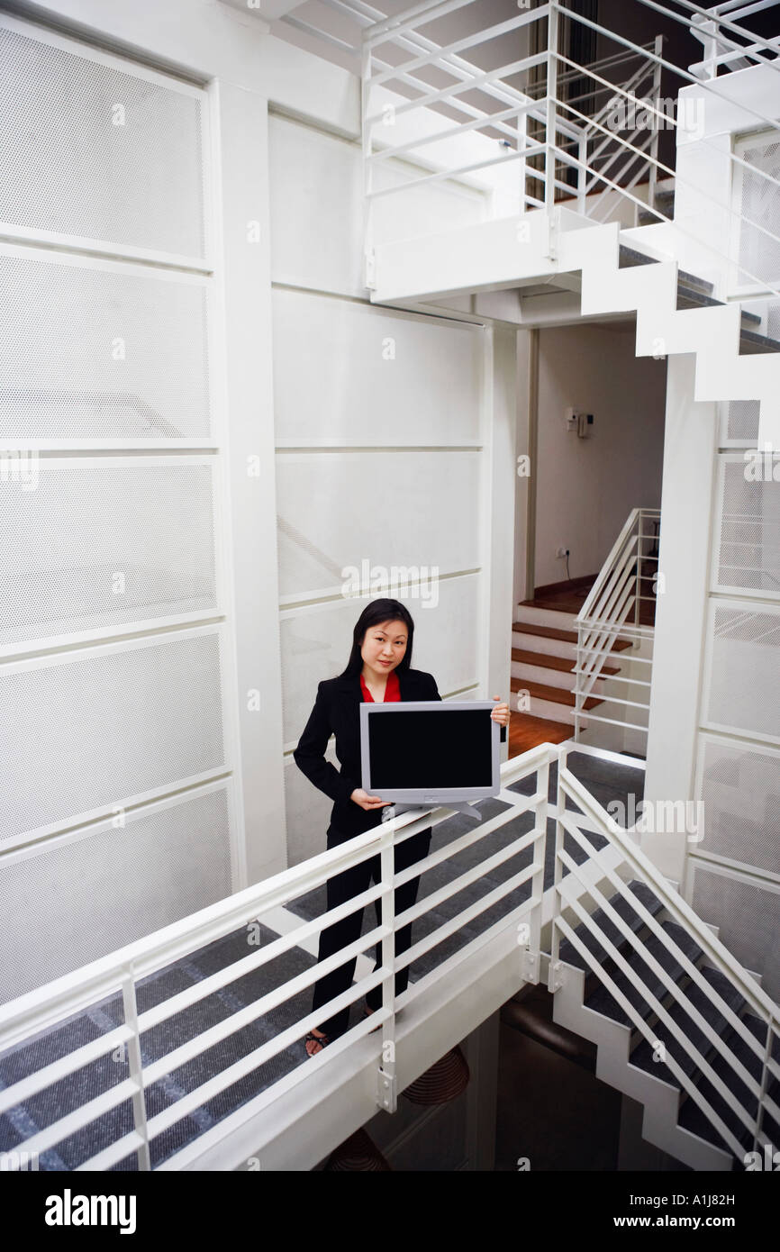 Portrait of a businesswoman showing a growth chart Stock Photo - Alamy