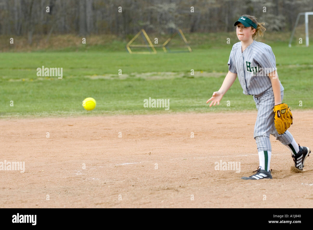 Female softball action throwing a ball Stock Photo - Alamy