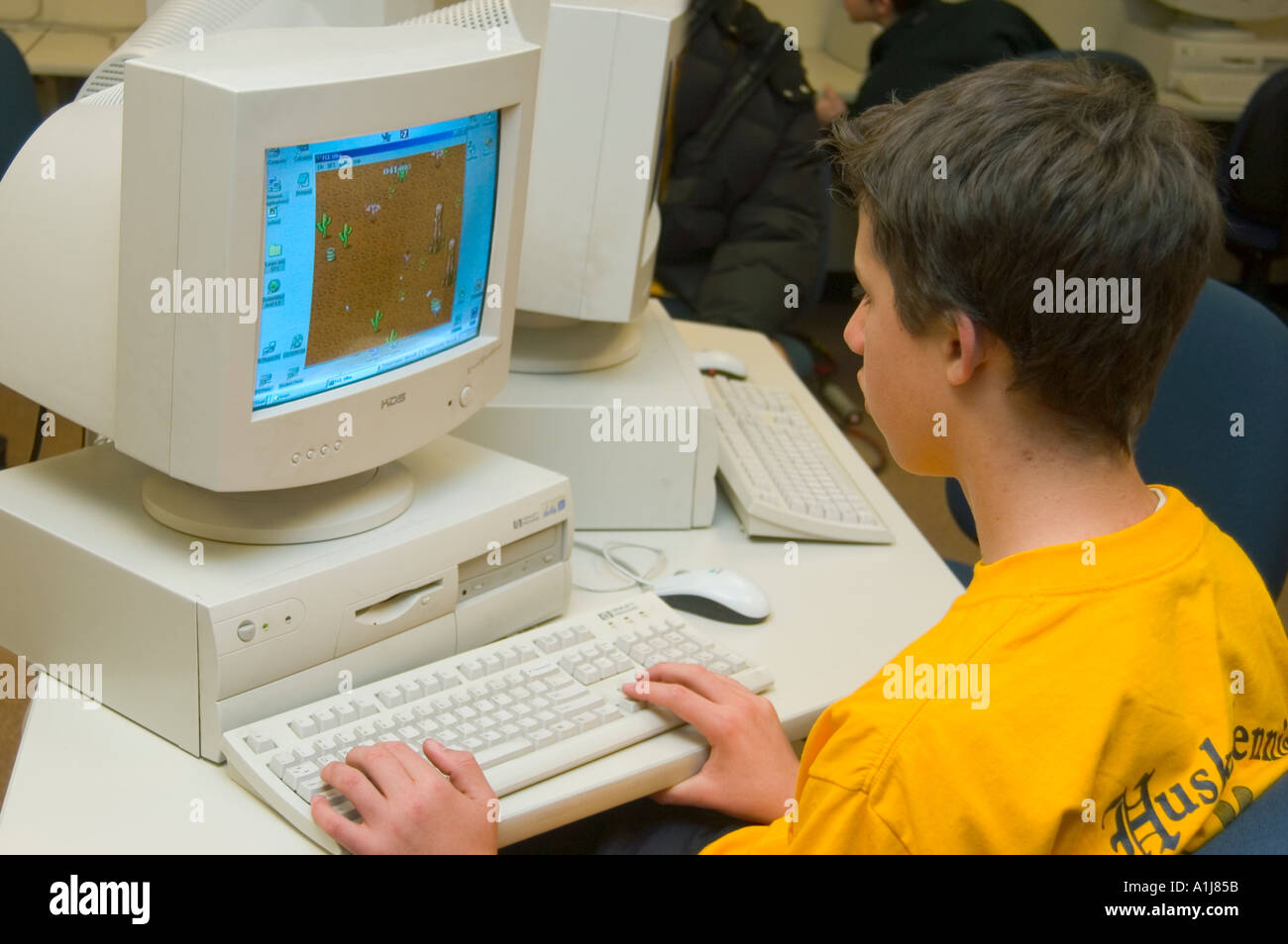 Male high school student works with computer in science class Stock ...