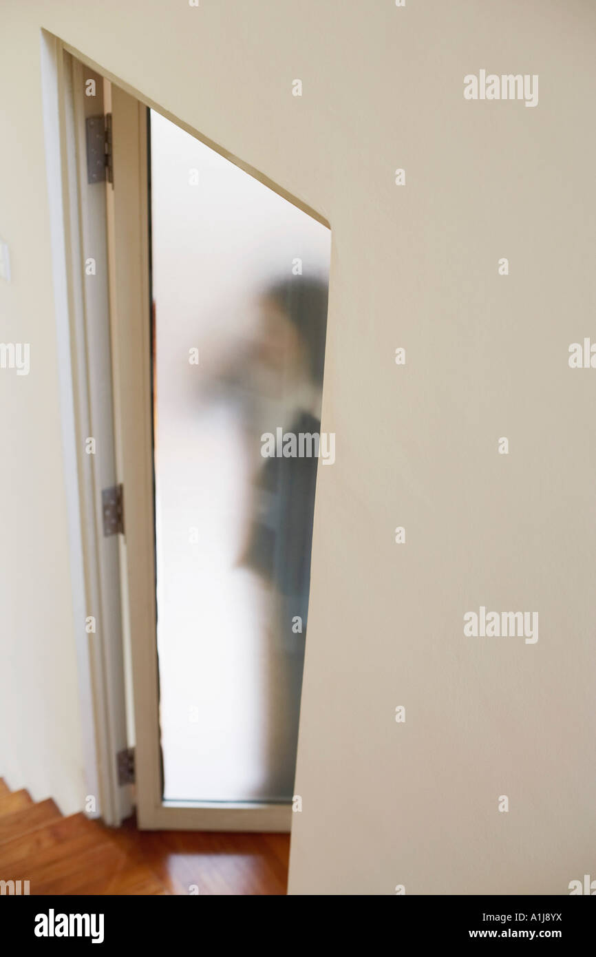 Woman Standing Behind Door Stock Photos & Woman Standing Behind Door ...