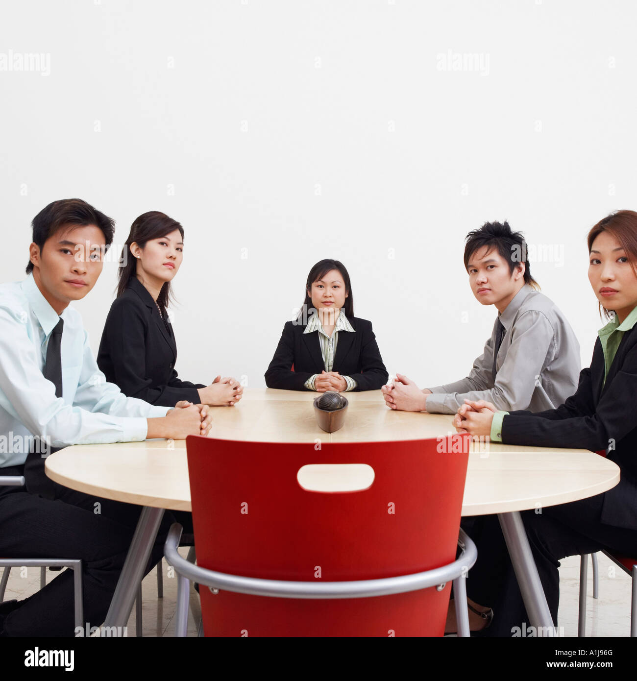 Portrait of business executives sitting in a board room Stock Photo - Alamy