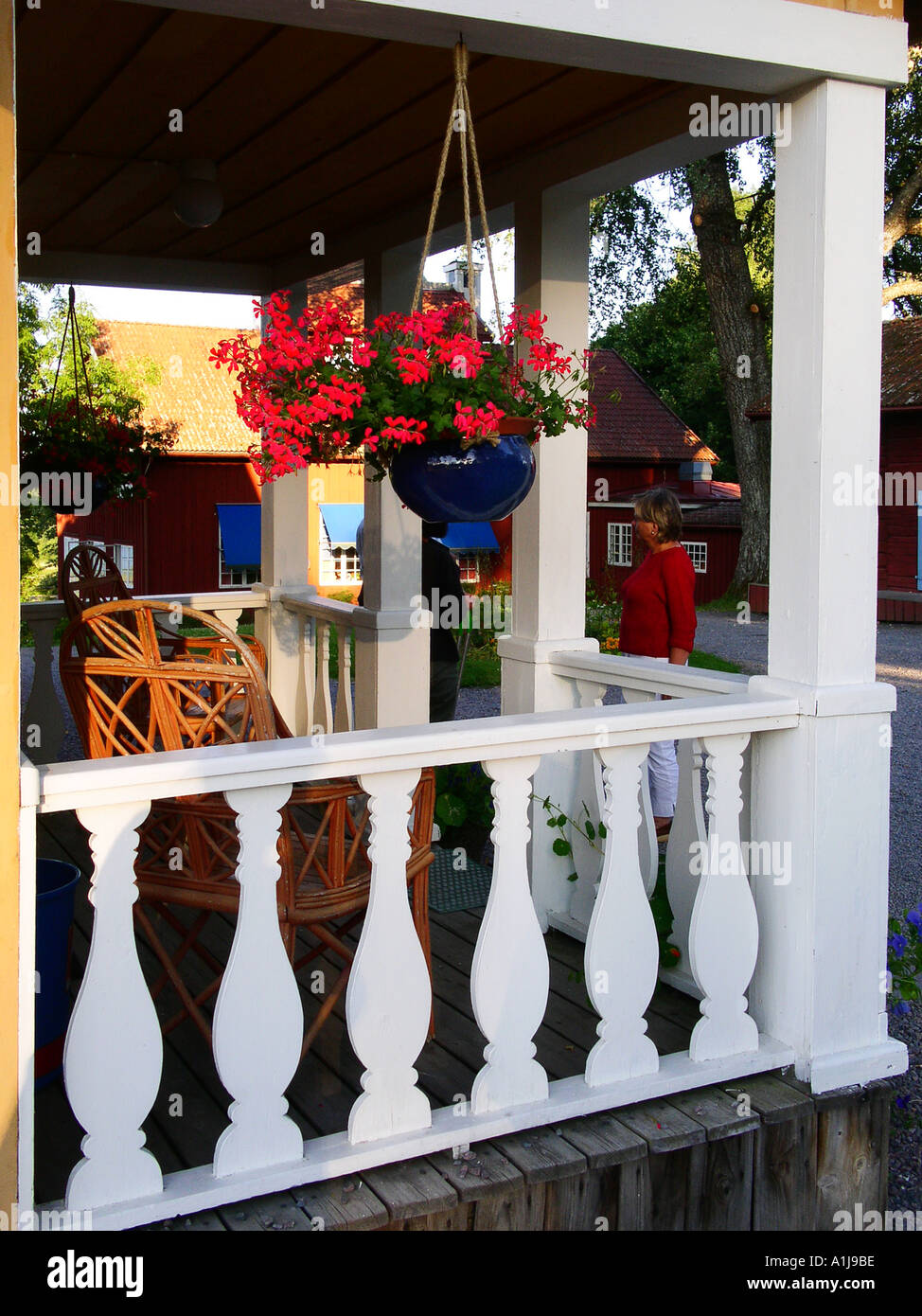 Sillegarden manor house near Sunne Varmland Sweden Balustraded verandah with hanging basket of ...