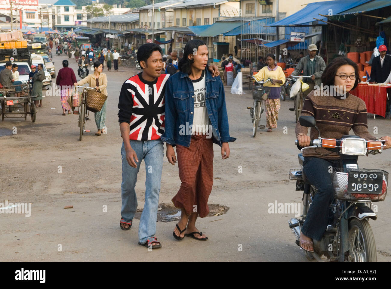Pyin U Lwin, Myanmar. Maymyo Burma Typical street scene. Two young men ...