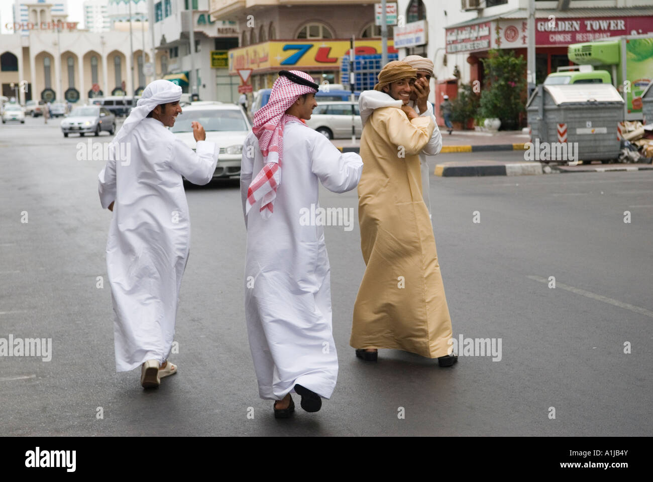 Abu Dhabi Young Arab men wearing their traditional clothes Arabs male ...