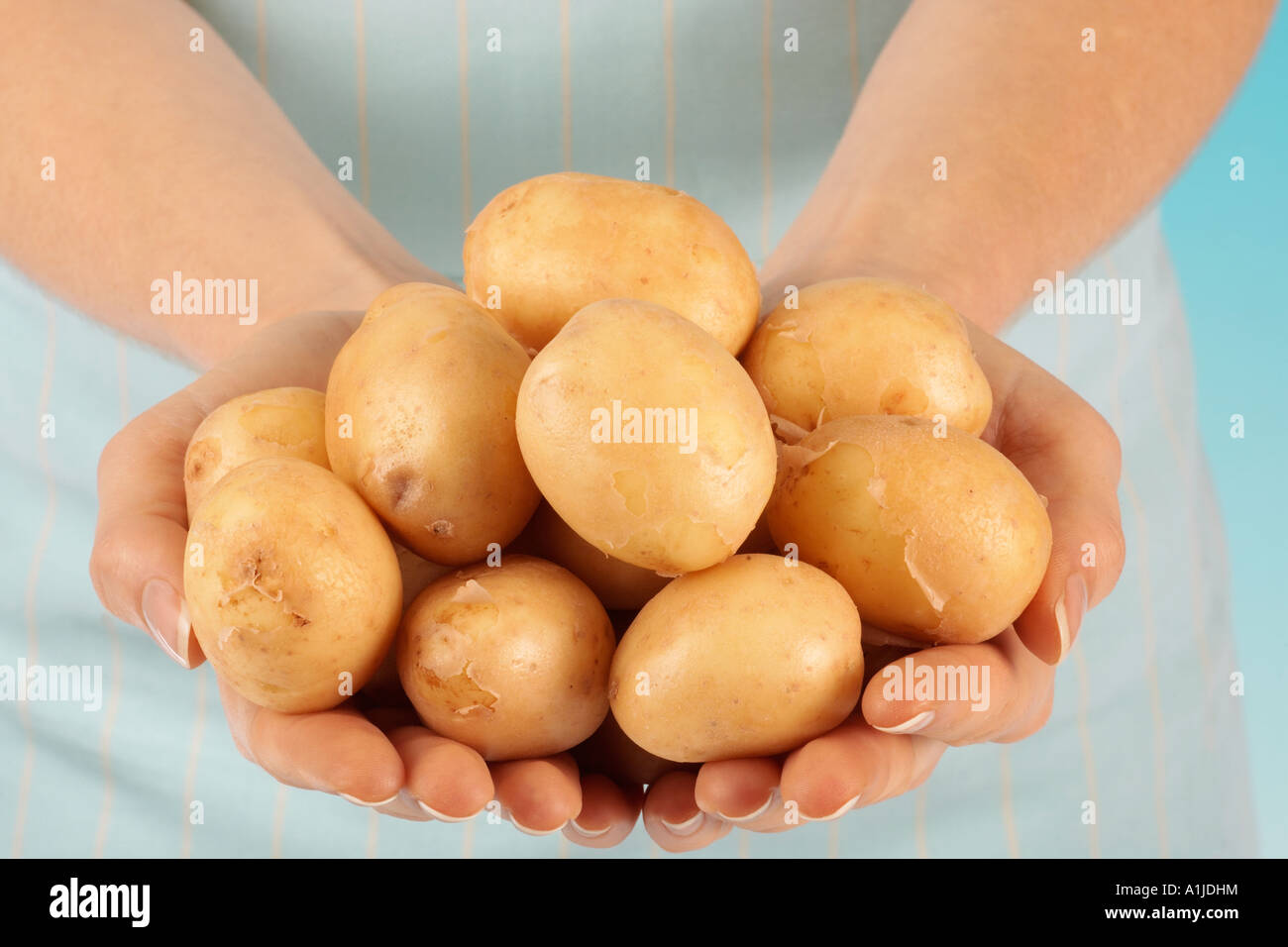 Girl holding potatoes hi-res stock photography and images - Alamy