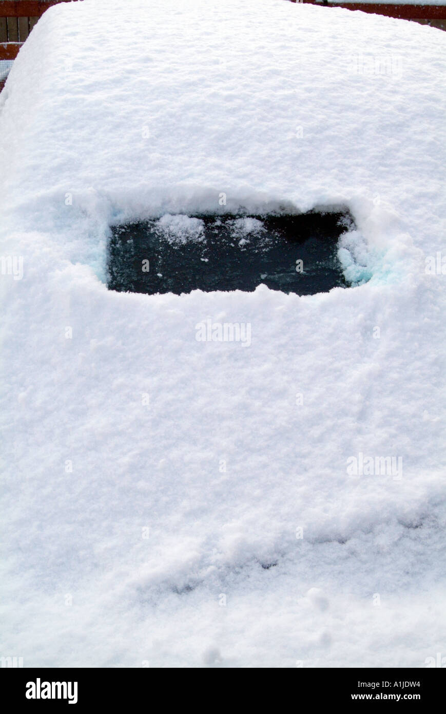 small clearing of snow from a cars windscreen Stock Photo - Alamy