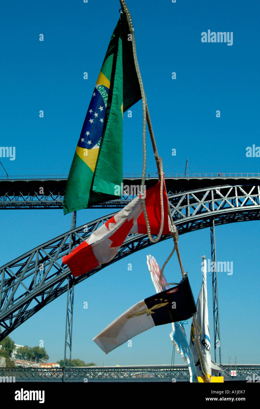 National flags hang on a line on the Douro River Cruise with the Dom ...