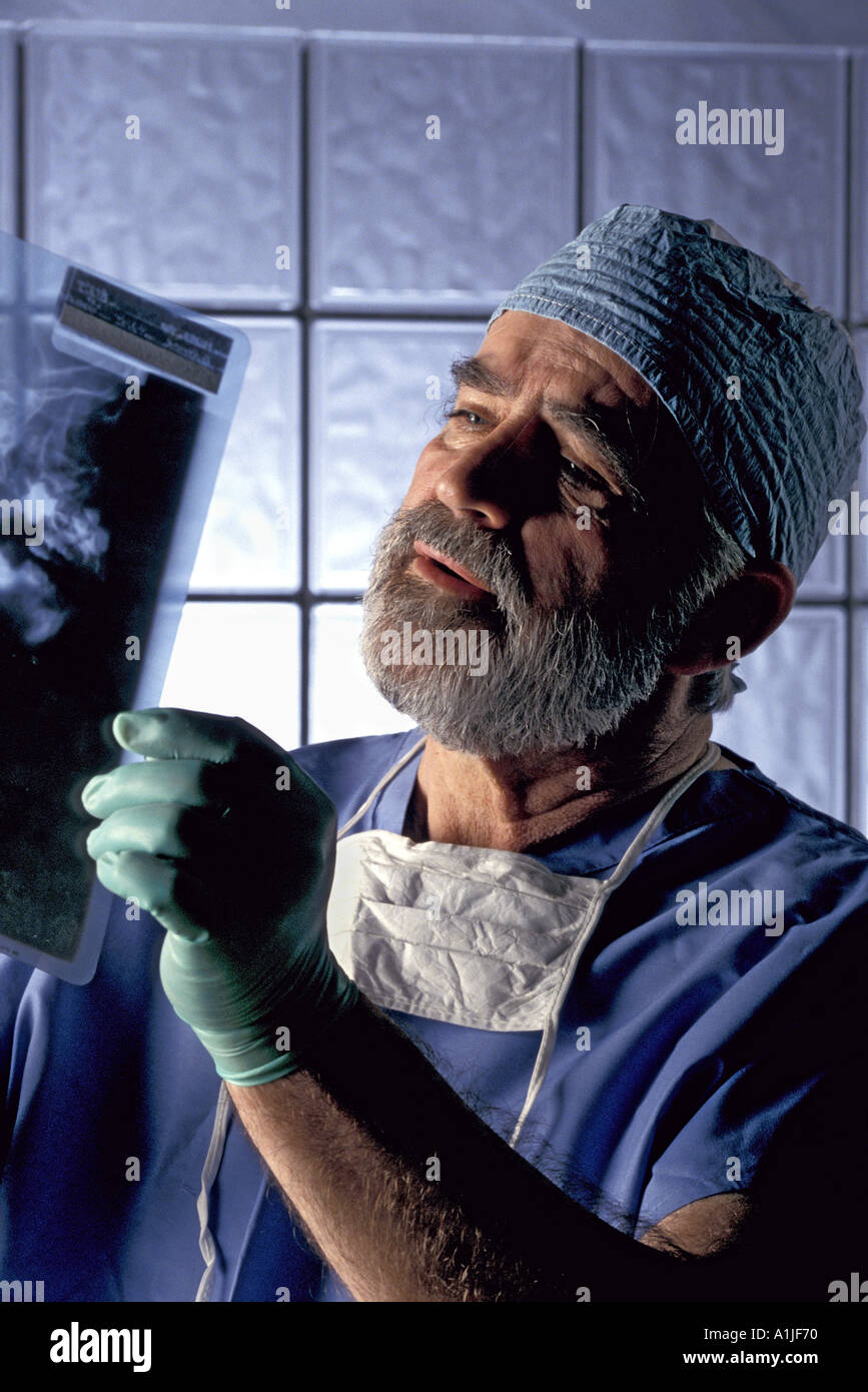 Caucasian male surgeon examining X ray before surgery Stock Photo - Alamy