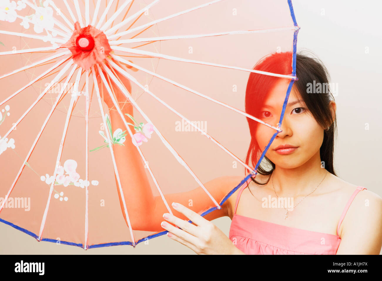 Woman holding a parasol hi-res stock photography and images - Alamy