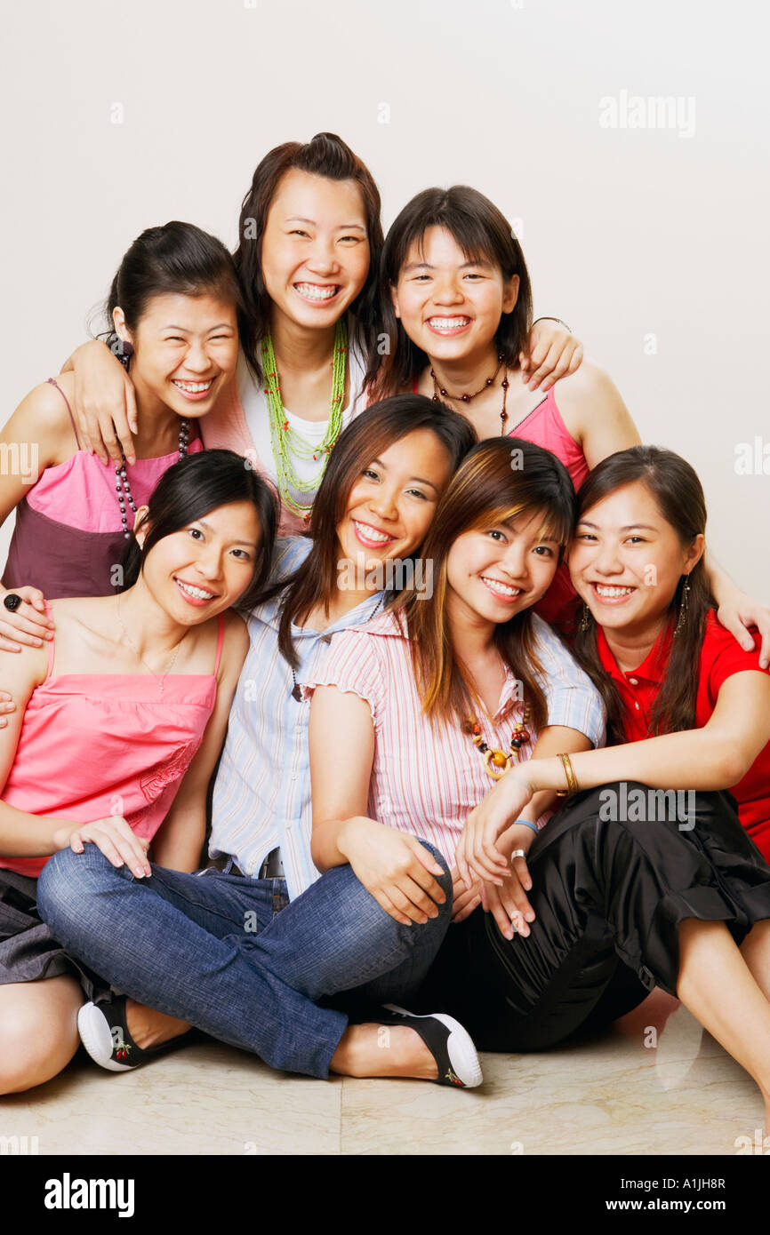 Portrait of a group of young women posing Stock Photo - Alamy
