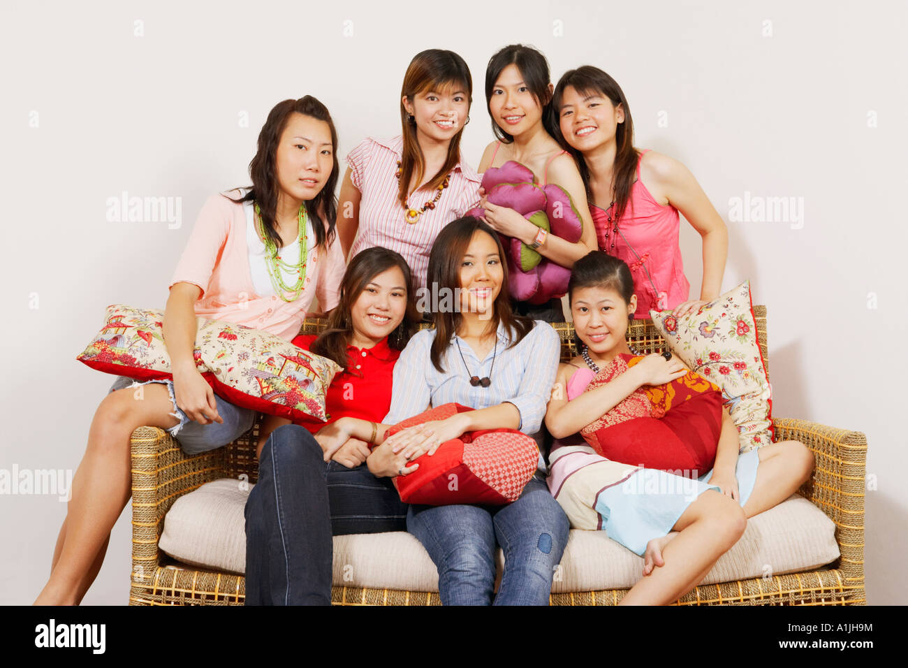 Portrait of a group of young women posing Stock Photo - Alamy